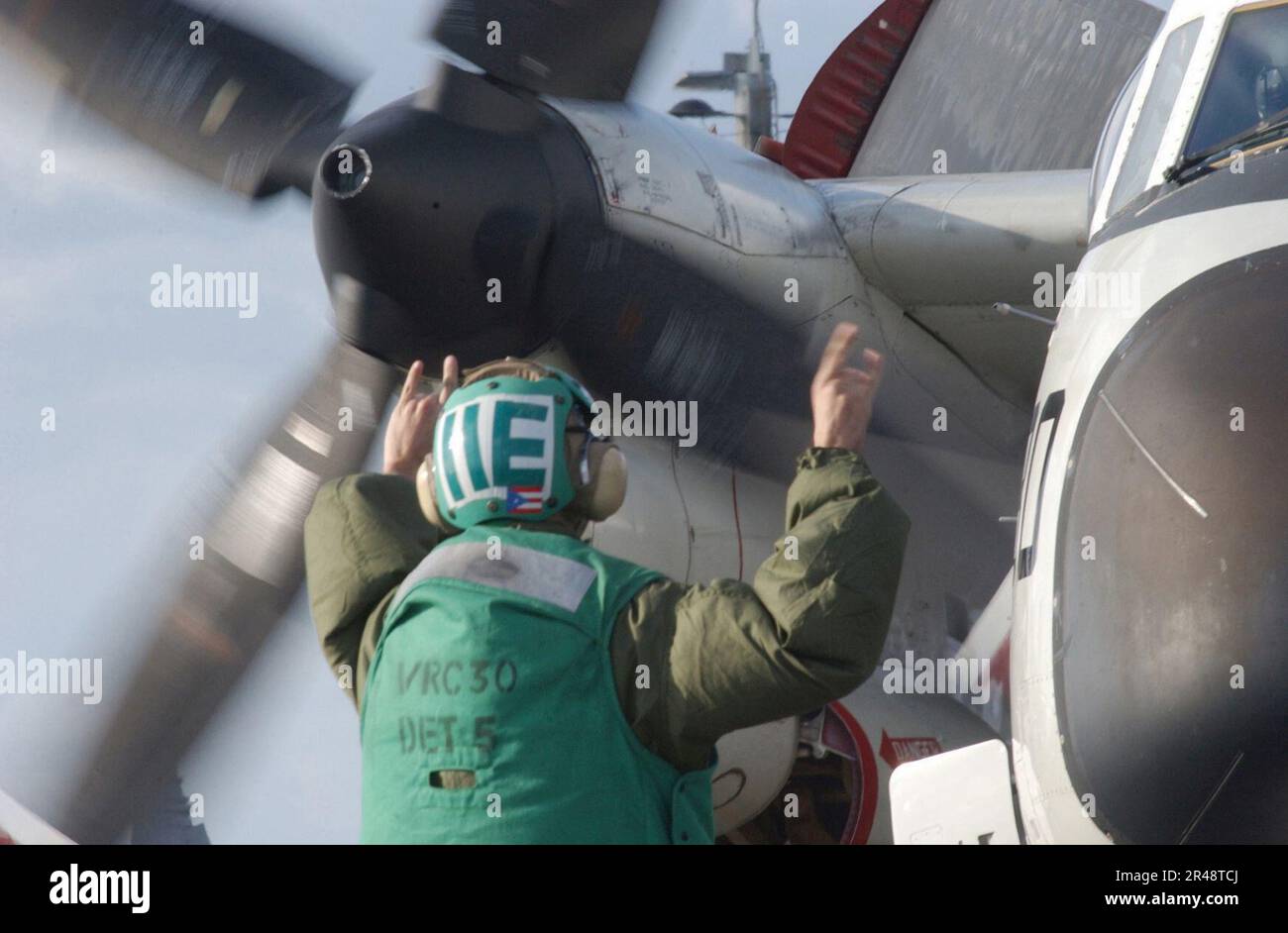 US Navy A plane captain for Fleet Logistic Support Squadron Three Zero ...