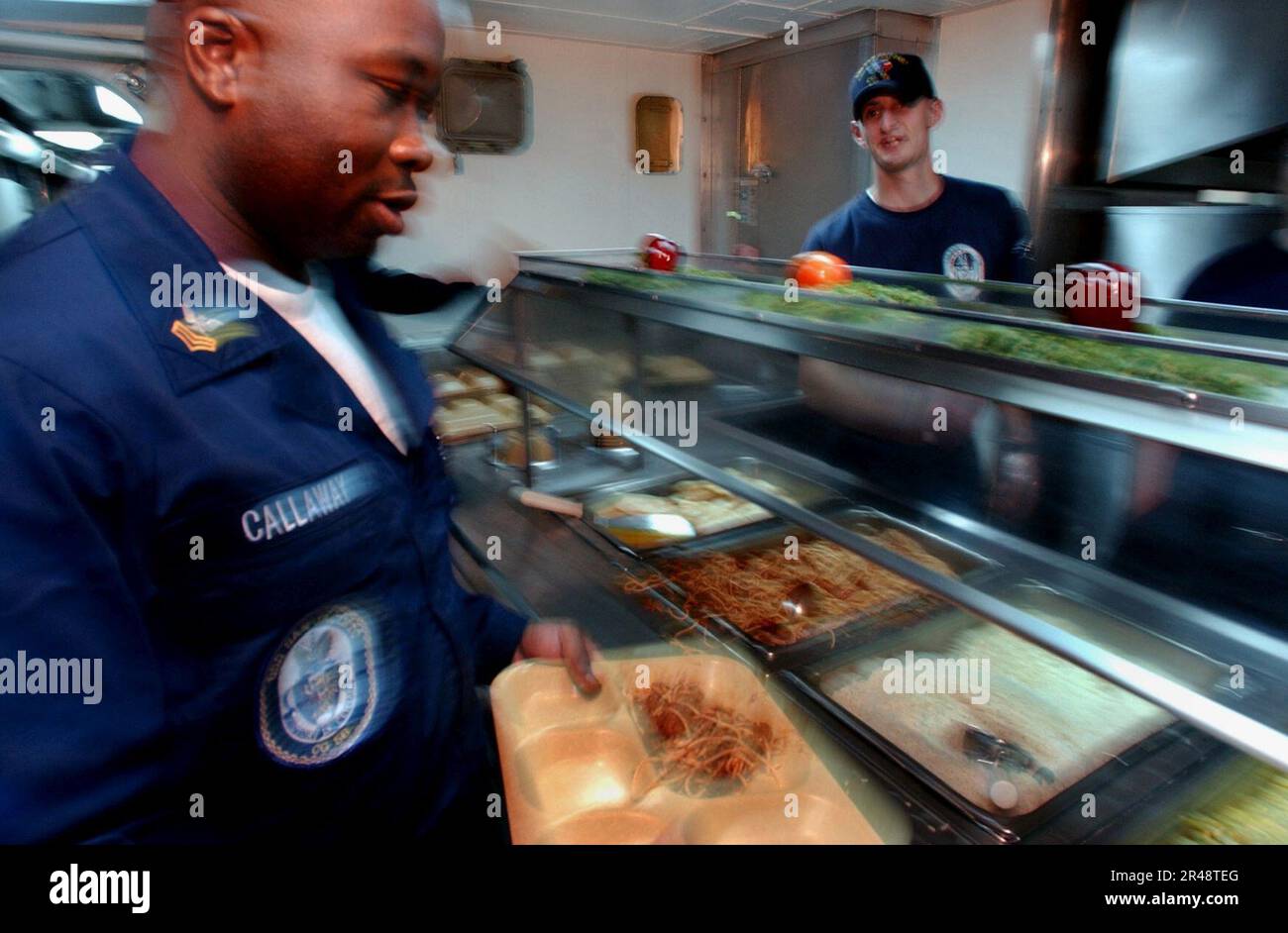 US Navy Gunners Mate 1st Class grabs a bite to eat at the self-service ...