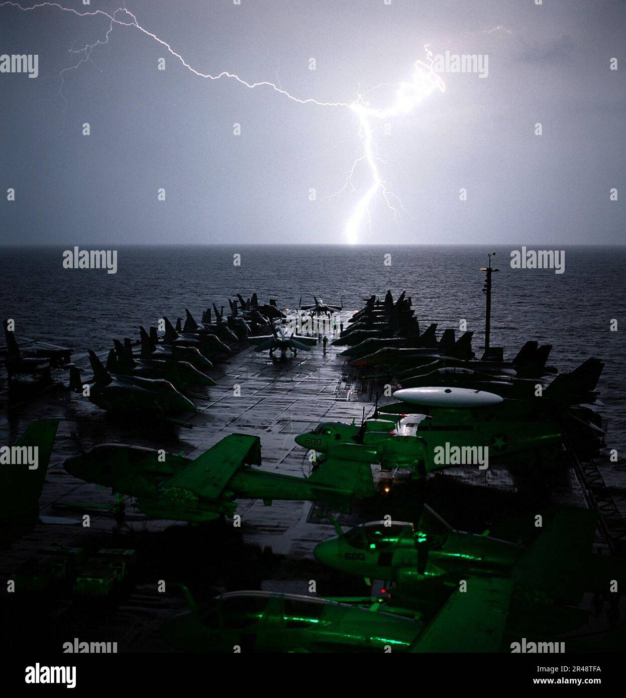 US Navy Lightning strikes light up the bow of USS Abraham Lincoln Stock ...