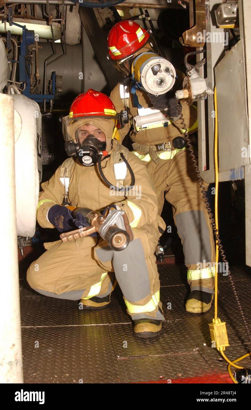 US Navy Damage control leader during a General Quarters (GQ) drill ...