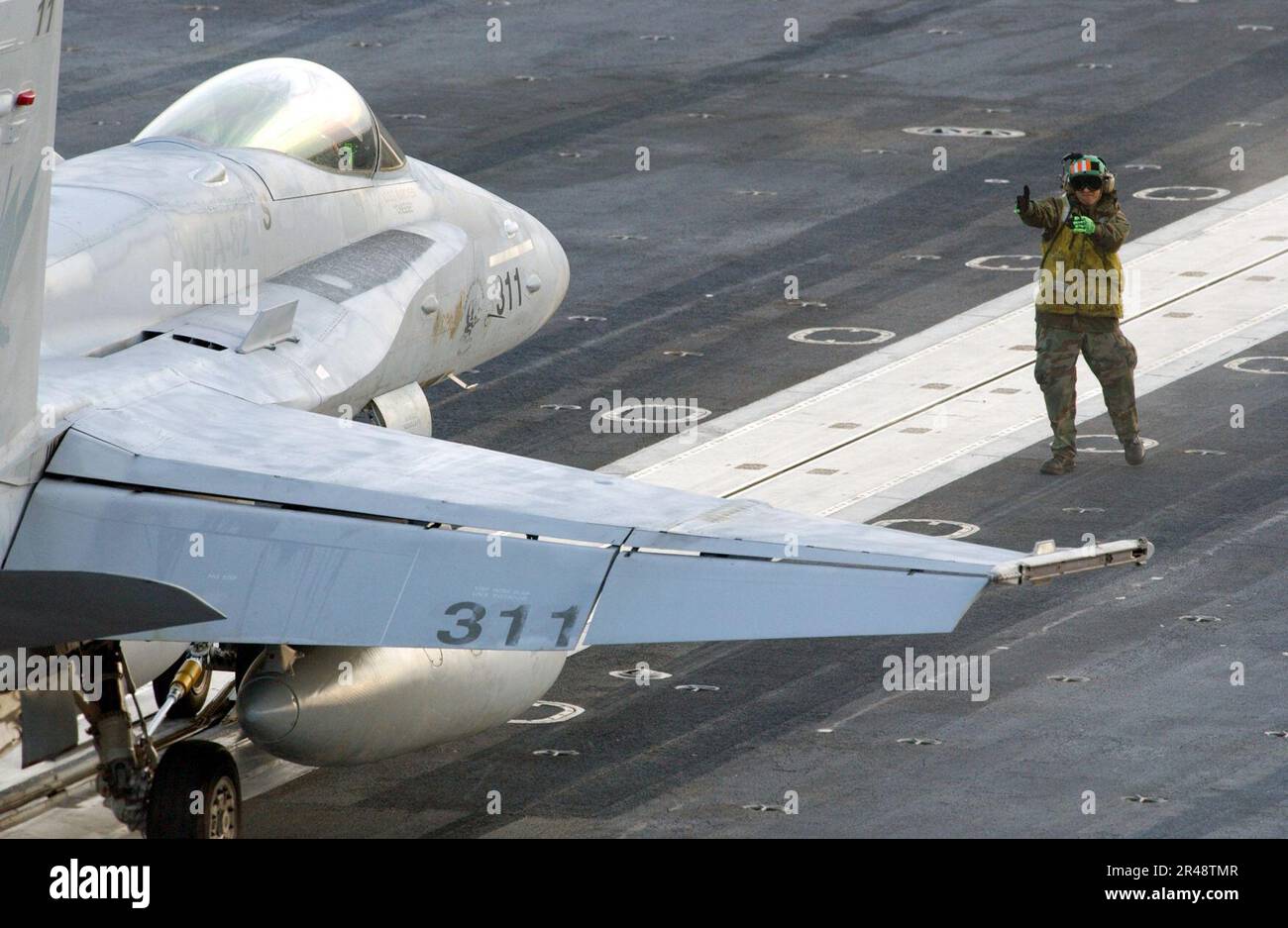 US Navy Directing a Hornet to a catapult Stock Photo - Alamy