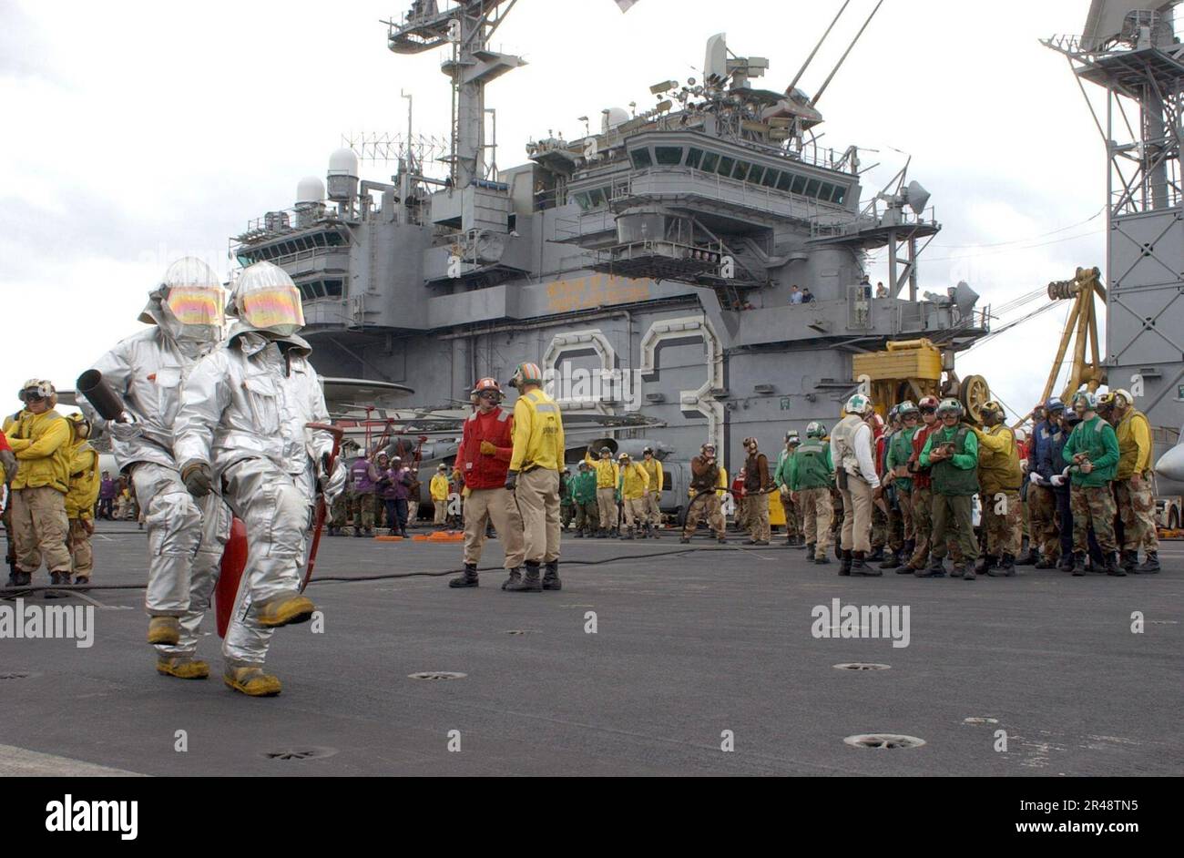 US Navy proper techniques on approaching an aircraft fire or a ...