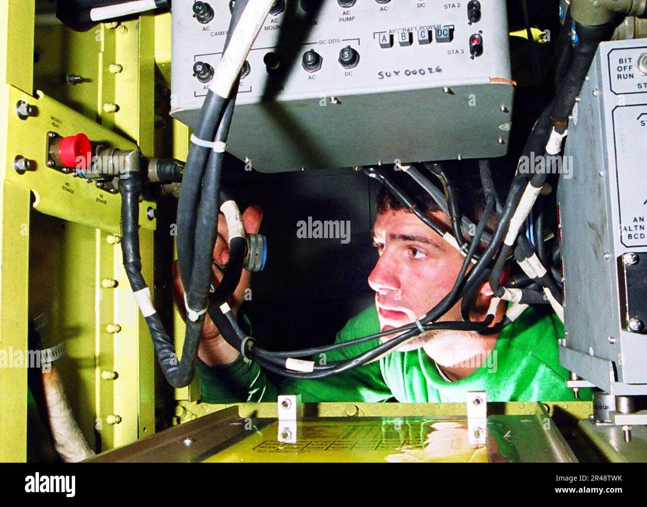 US Navy Photographer's Mate works on the Tactical Air Reconnaissance ...