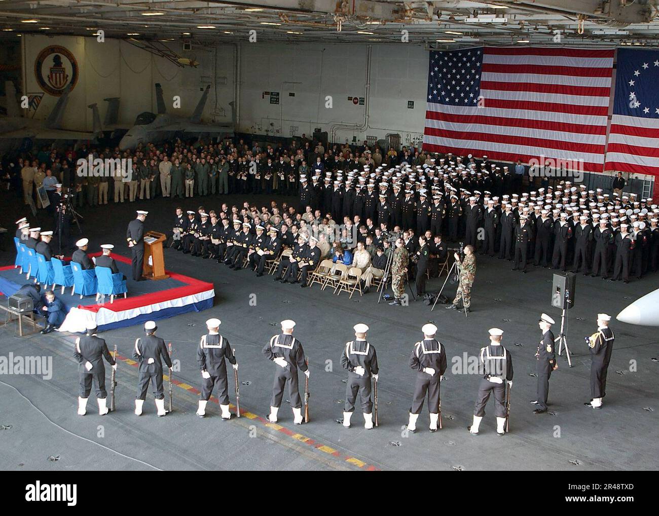 US Navy Sailors aboard the Washington attend a memorial service held in ...