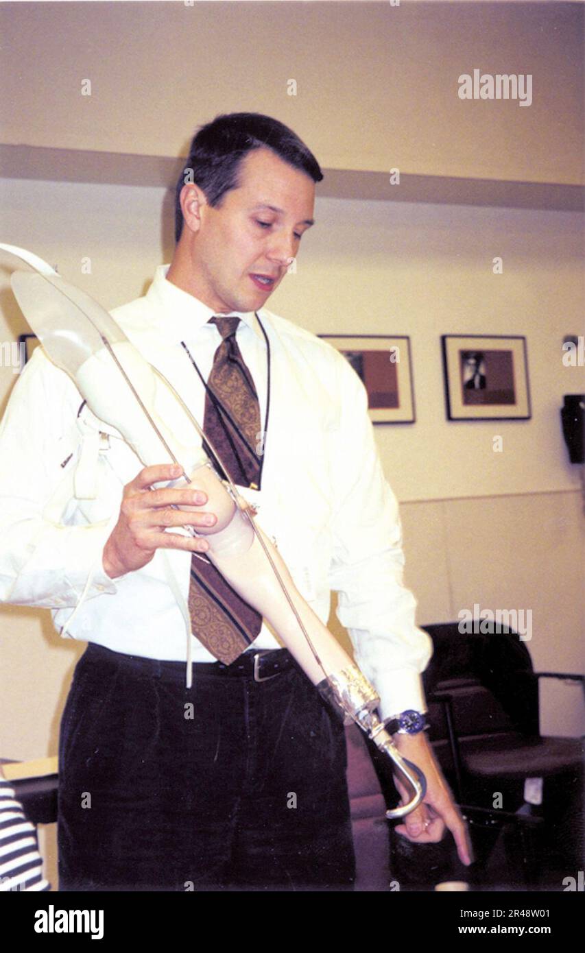 US Navy Joe Miller, a WRAMC prosthetist, displays the prosthetic arm ...