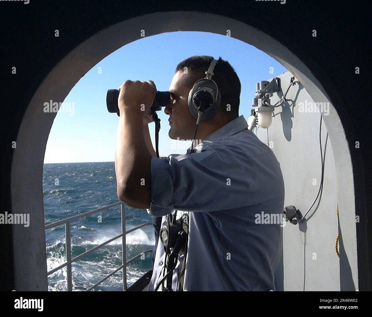 US Navy A sailor stands the aft port lookout watch while aircraft are ...