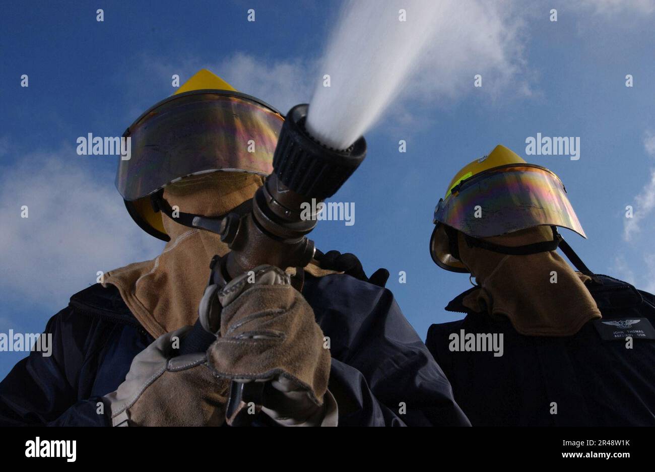 US Navy Members of the training staff demonstrate effective ...