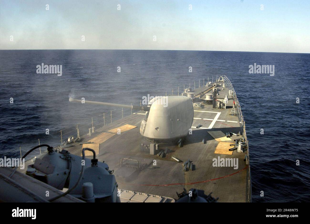 US Navy Smoke is released from the barrel of the ship's MK-45 five inch ...