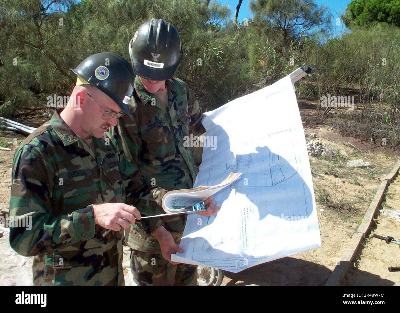 US Navy Builder 1st Class (left) reviews specifications with Builder ...