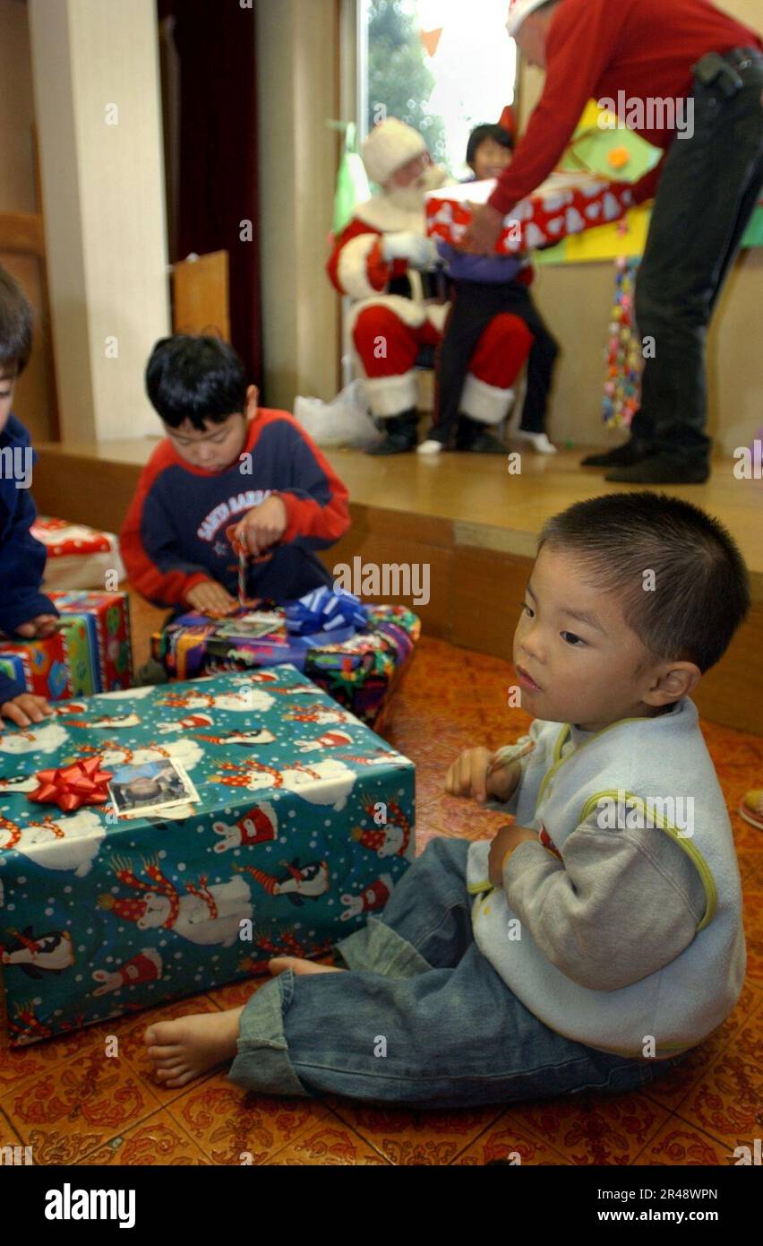 US Navy A young boy from the Elizabeth Saunders Home for orphans opens ...