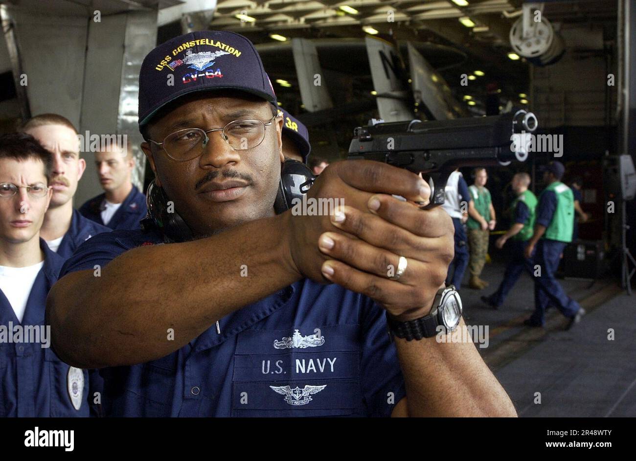 US Navy proper aiming technique during 9mm weapons qualifications Stock ...