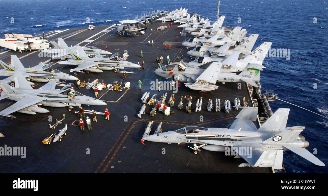 US Navy Aviation Ordnancemen inventory and attach new weapons onto ...