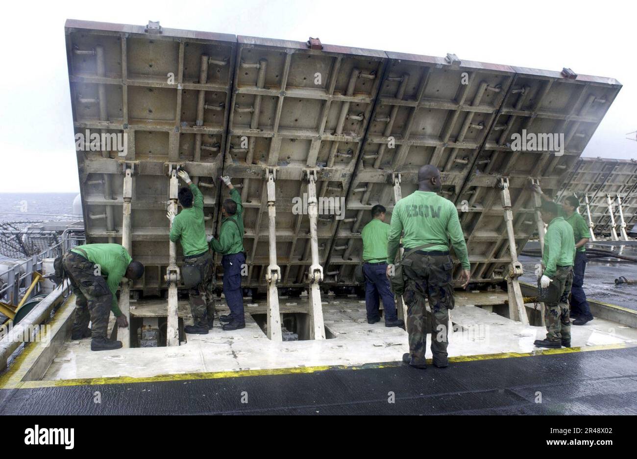 US Navy maintenance on one of four Jet Blast Deflectors Stock Photo - Alamy
