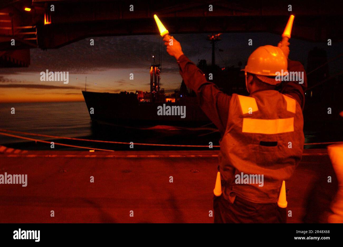 US Navy using semaphore to communicate with the crew of another ship ...