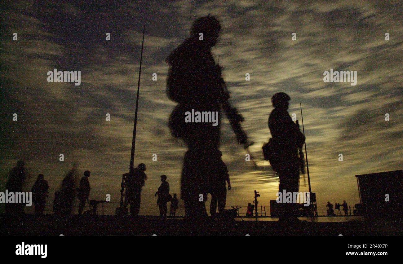 US Navy U.S. Marines stand watch on the main deck aboard USS Mount ...