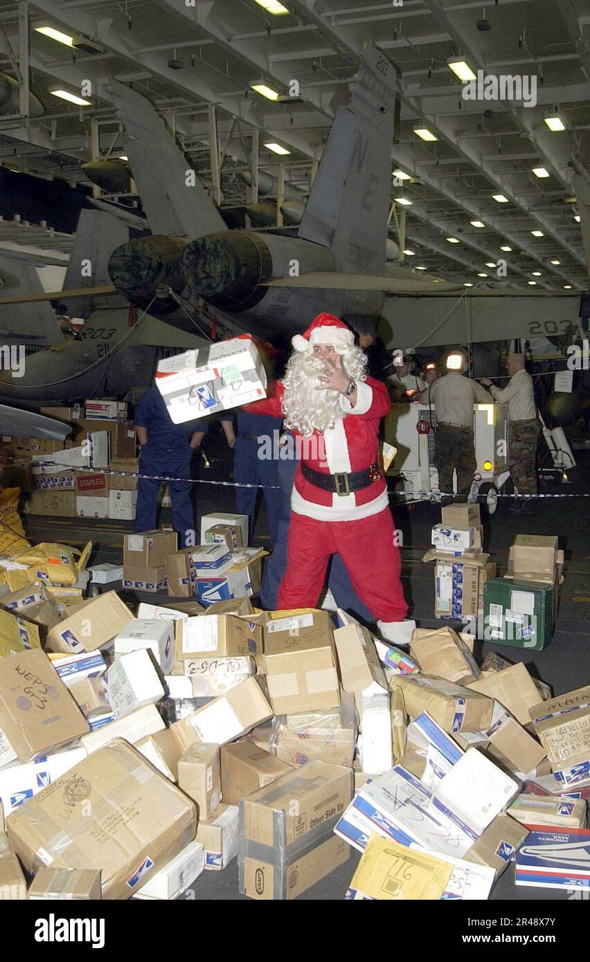 US Navy Santa Claus helps pass out mail that has just arrived Stock ...