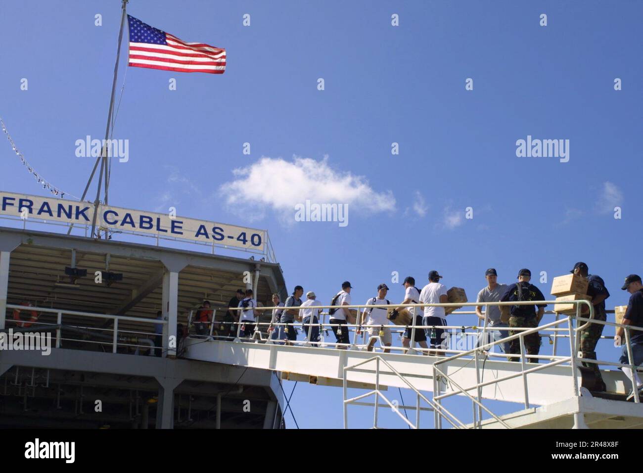 US Navy Volunteers from various CNFJ commands load stores aboard the ...