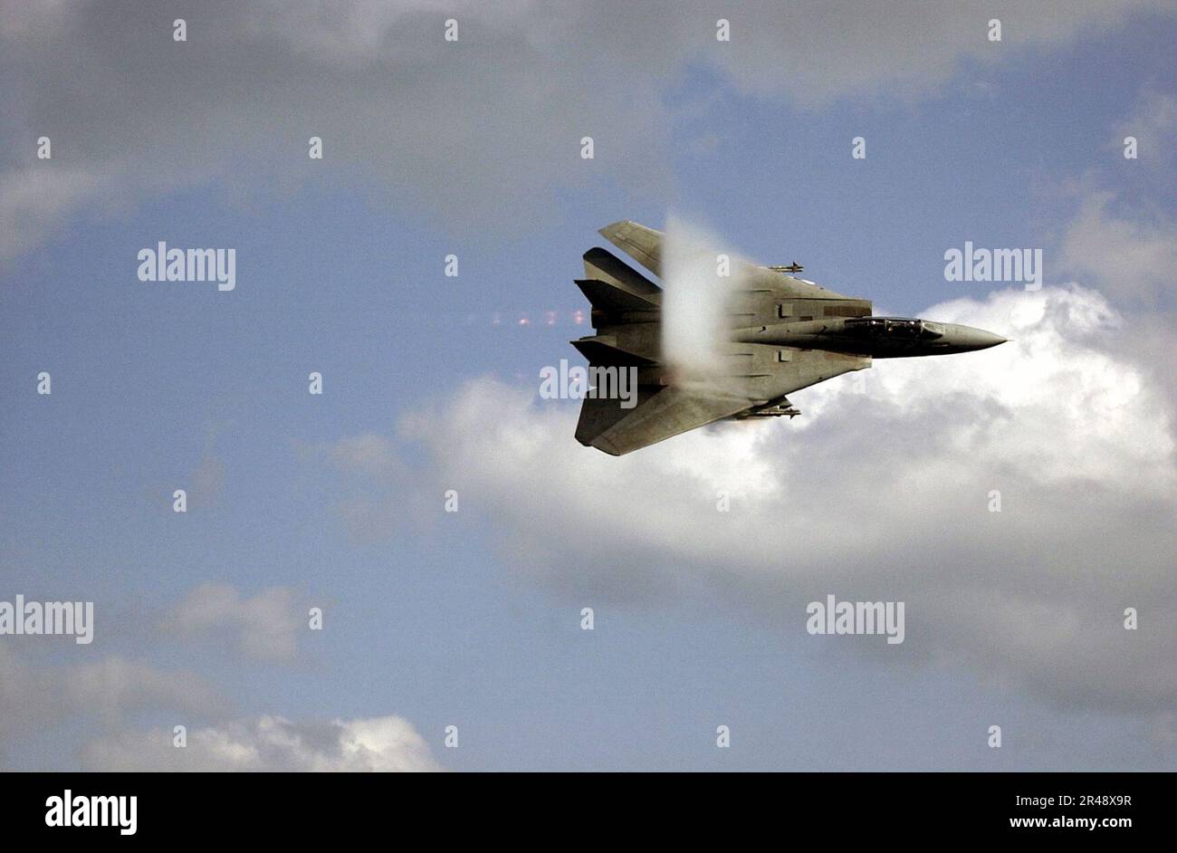 US Navy tomcat flies over the ship's flight deck during Christmas ...