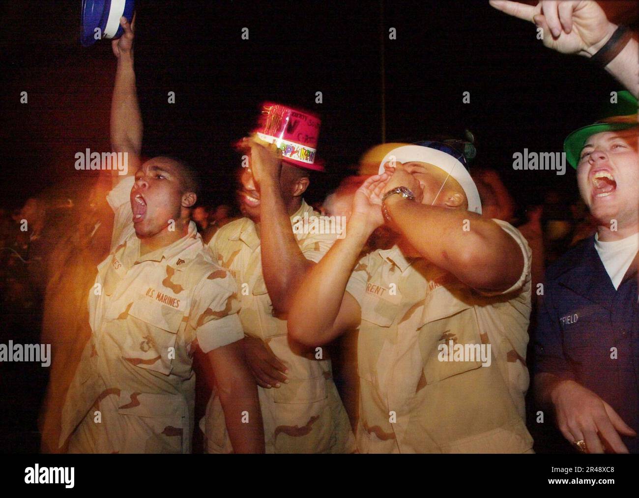 US Navy Sailors and Marines celebrate the arrival of the new year ...