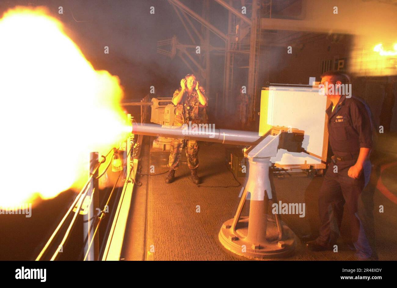 US Navy A ceremonial saluting battery fires a blast from the main deck ...