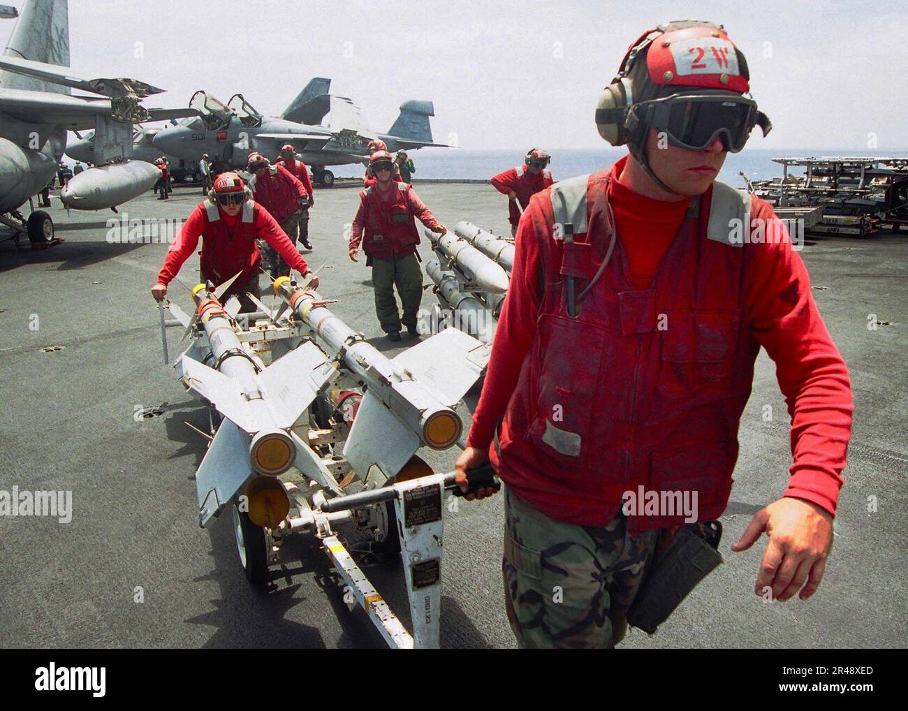 US Navy Aviation Ordnancemen assigned to the Eagles of Strike Fighter ...