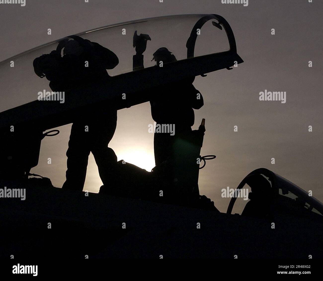 US Navy Flight deck personnel perform preventive maintenance on the ...