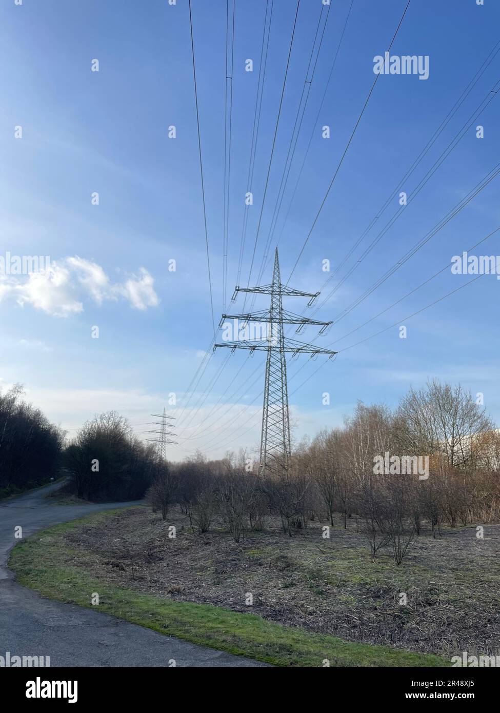 A high-voltage transmission tower in a rural area Stock Photo - Alamy