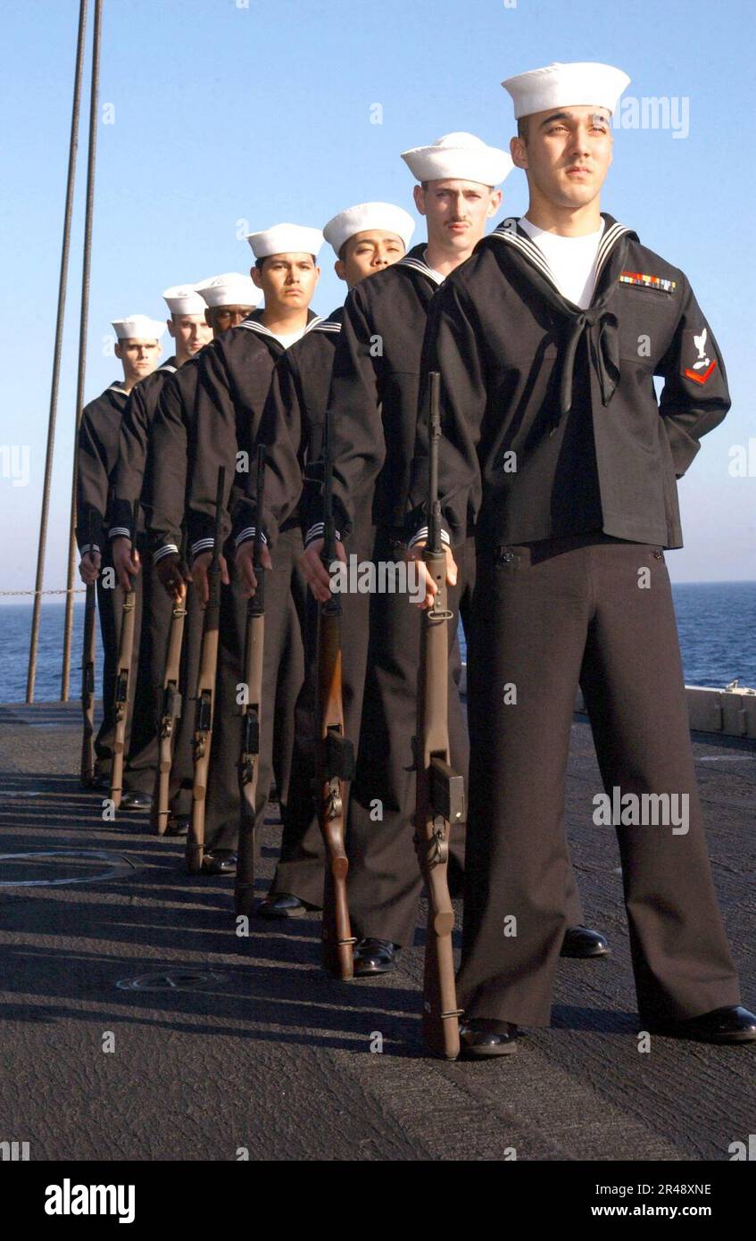 US Navy Members of the Harry S. Truman ceremonial saluting detail stand ...