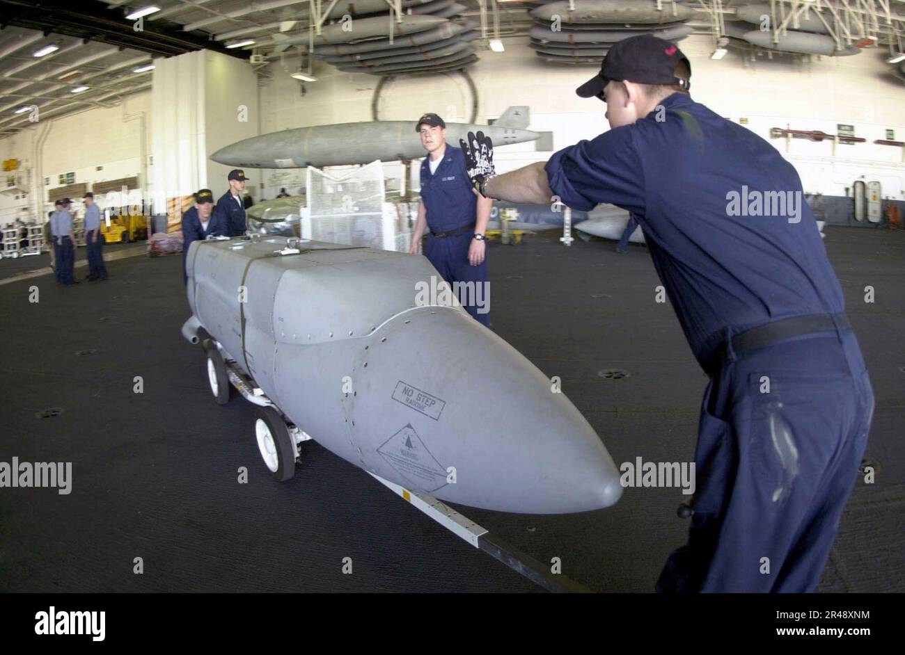 US Navy moving a Shared Reconnaissance Pod (SHARP) from the ship's ...