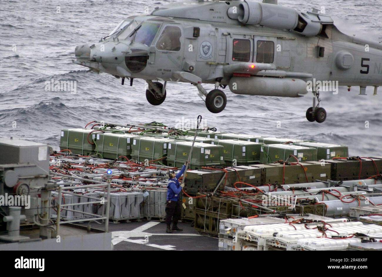 US Navy transporting ordnance from USS Bridge (AOE 10) to Nimitz Stock ...