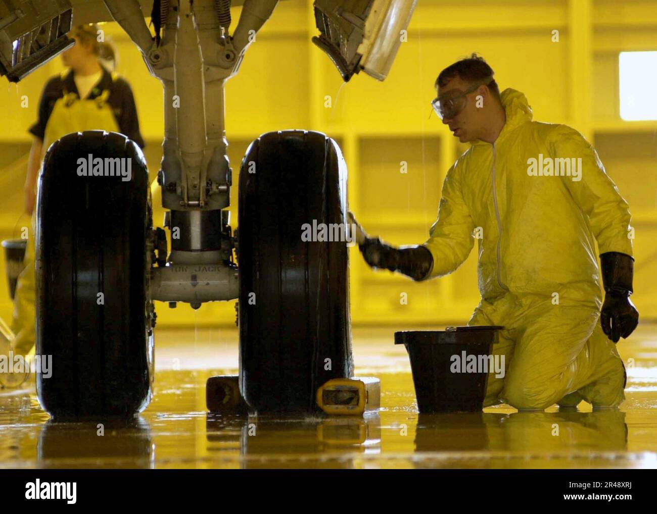 US Navy cleaning the tire rims on a P-3C Stock Photo - Alamy