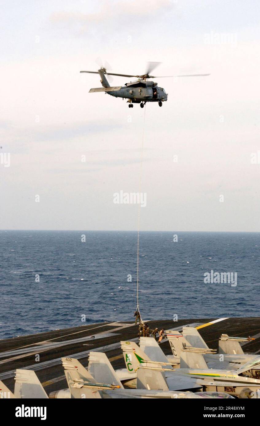 US Navy Explosive Ordnance Disposal (EOD) personnel are lifted off the ...