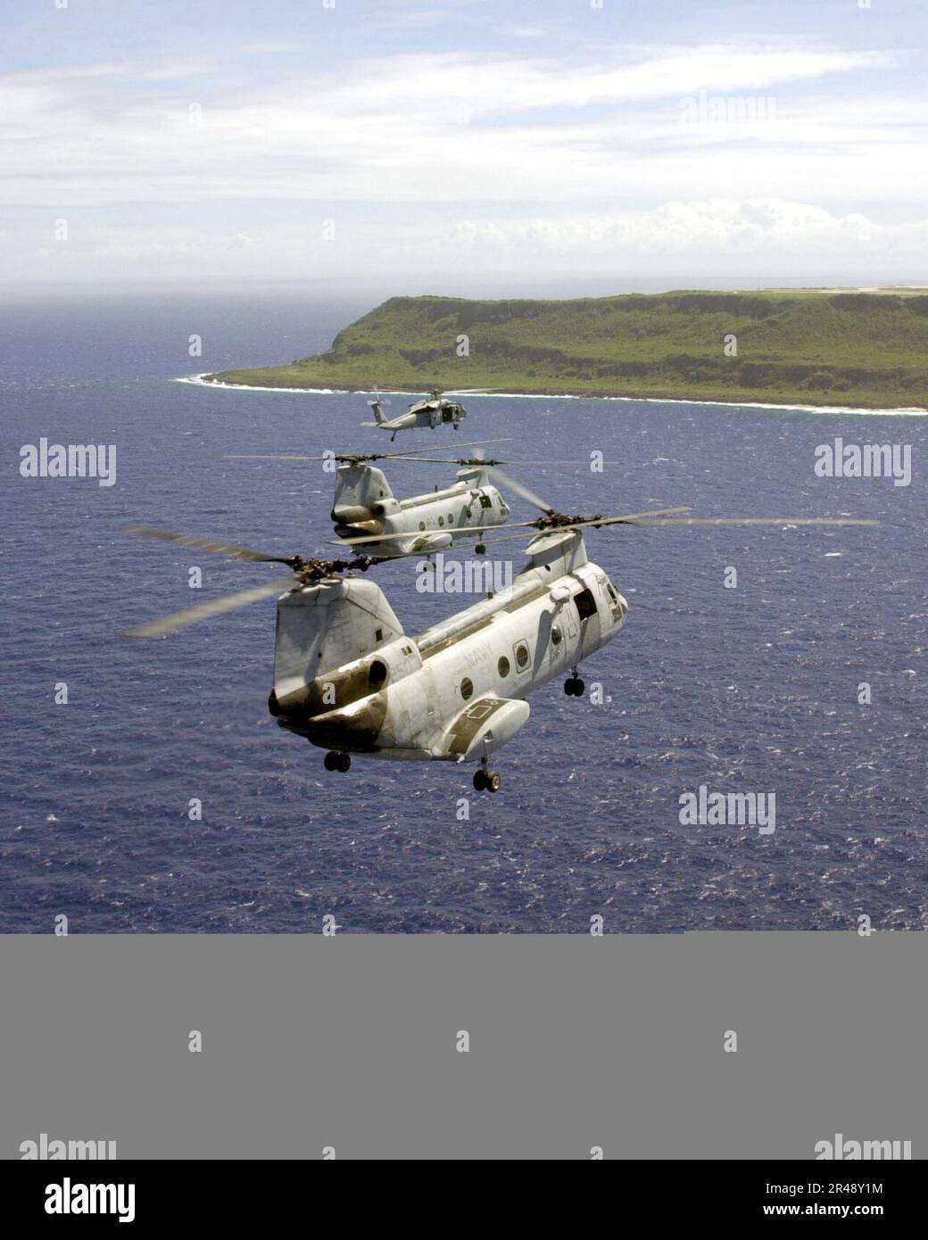 US Navy Two UH-46 ''Sea Knights'' and one UH-60 ''Black Hawk'' fly ...