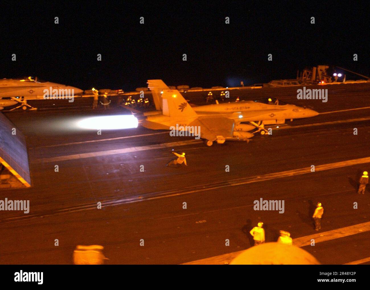 US Navy F-A-18 Hornet makes a night catapult launch Stock Photo - Alamy