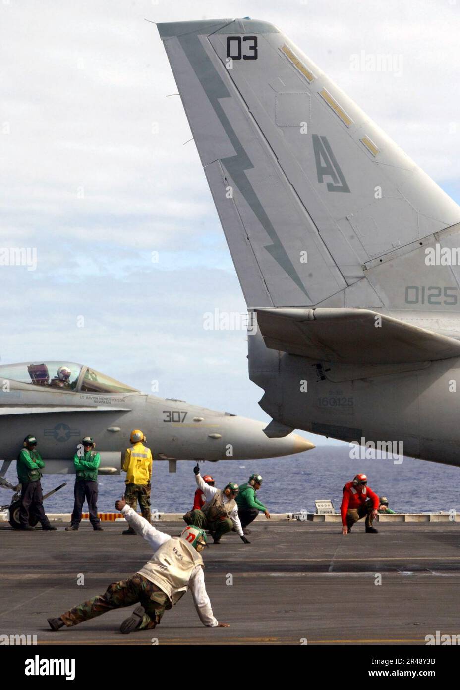 US Navy safety observer gives the thumbs-up signal before an S-3B ...