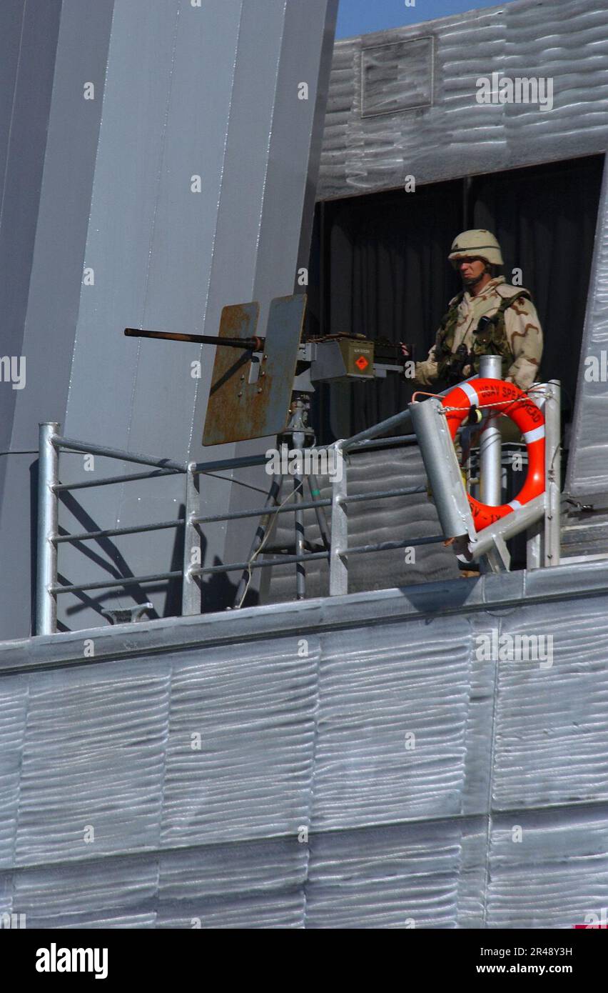 US Navy A soldier stands watch with a .50 caliber machine gun Stock ...