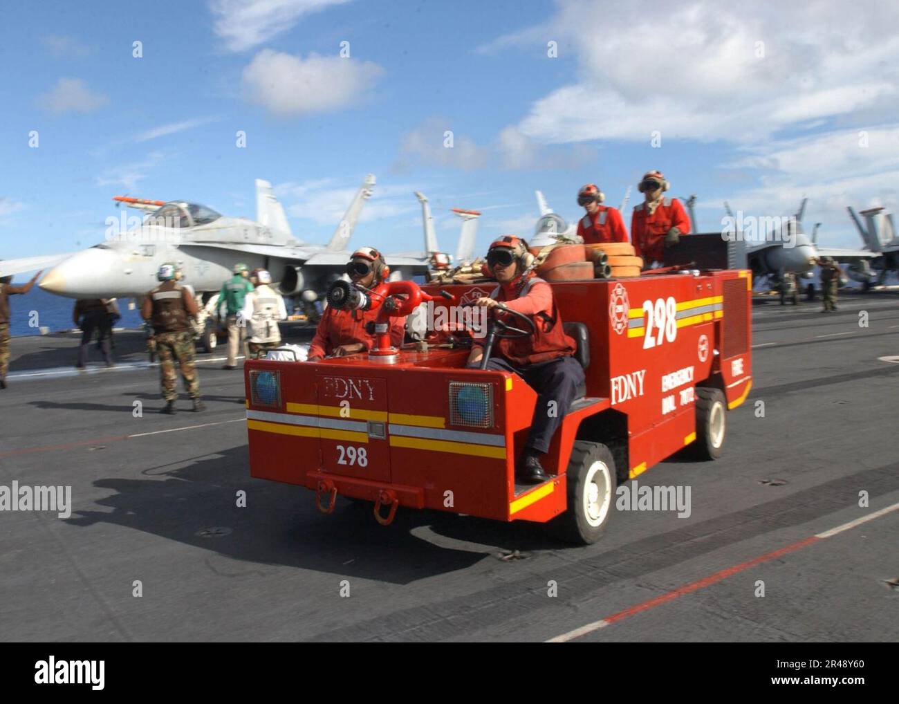 US Navy Crash and Salvage personnel move into position for flight ...