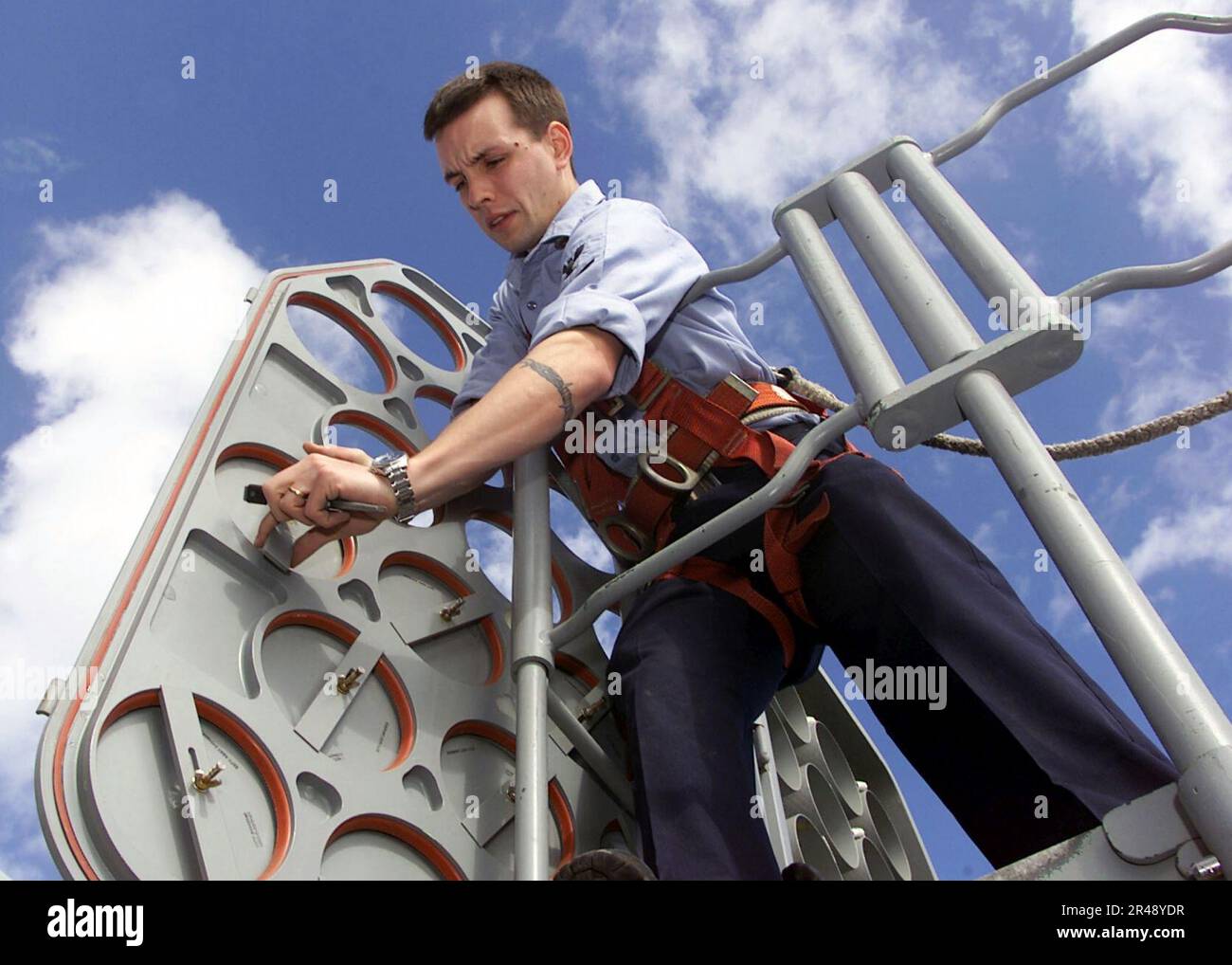 US Navy Fire Controlman prepares a Rolling Airframe Missile (RAM) for ...