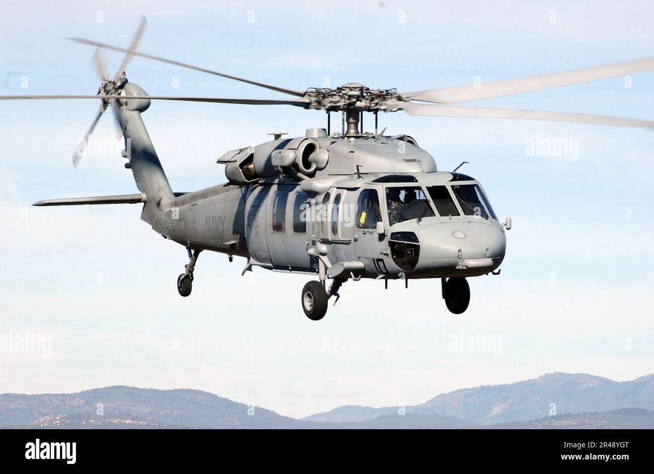 US Navy SH-60S flies over the Southern California mountains during ...