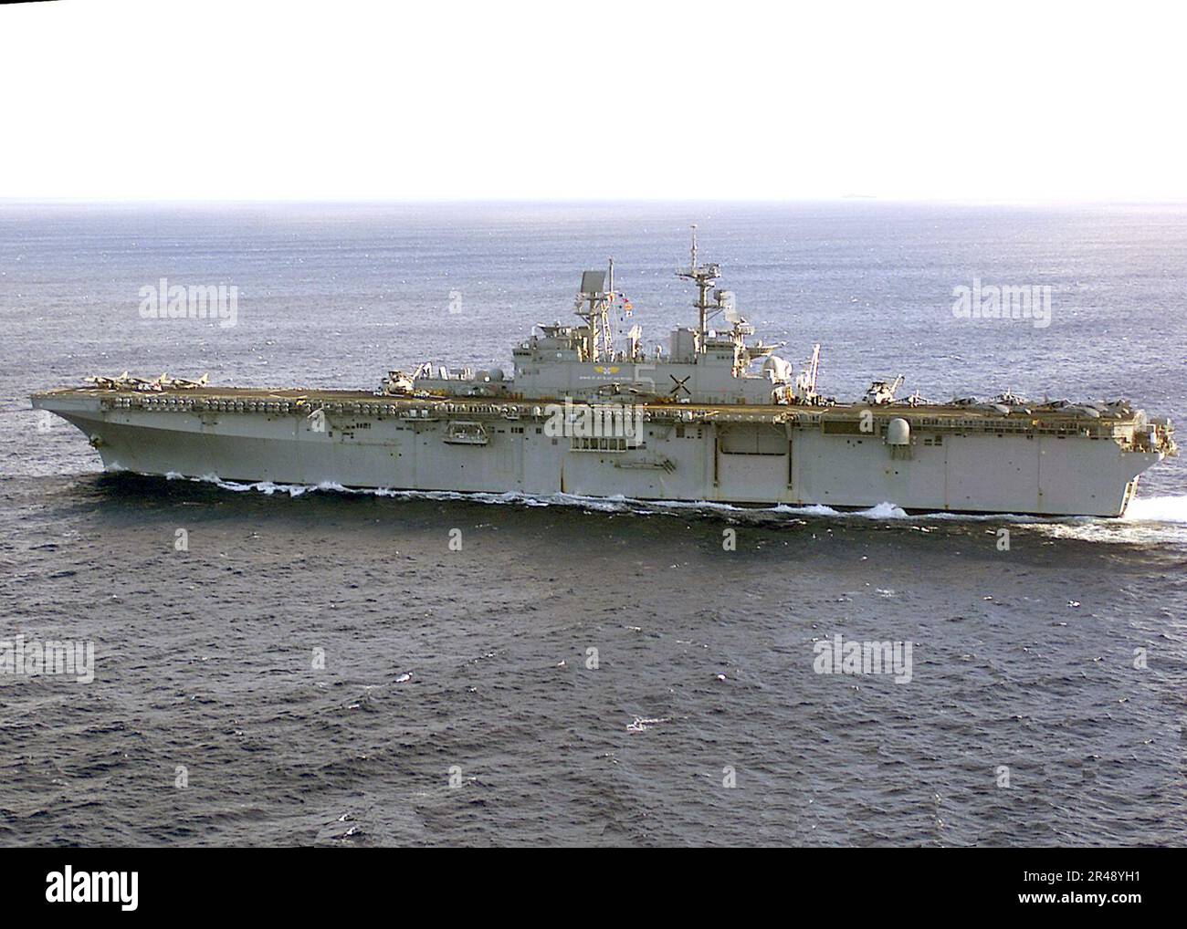 US Navy USS Bataan (LHD 5) steams through the Atlantic Ocean as one of ...