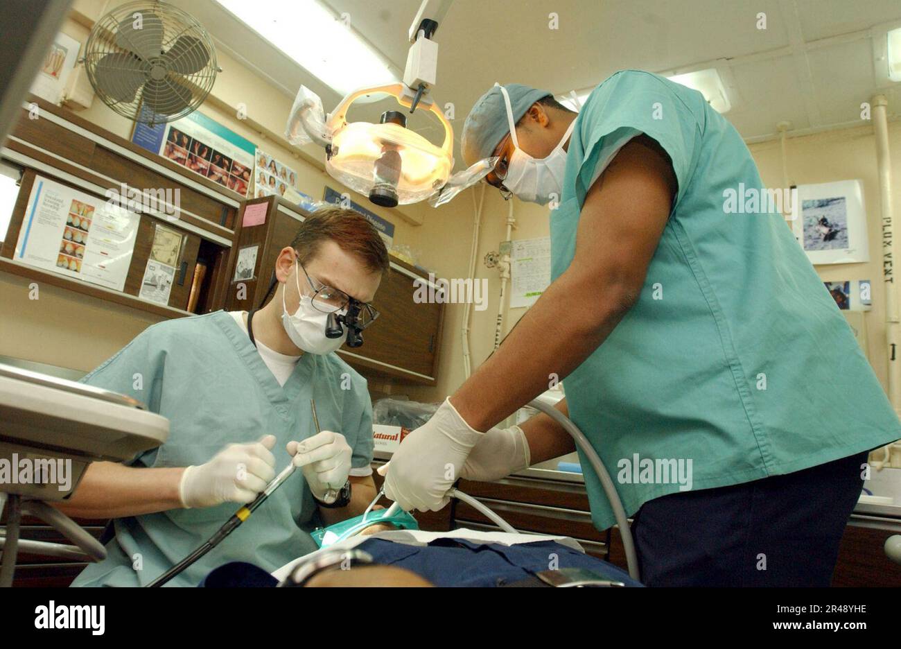 US Navy Navy dentist treats patients aboard ship Stock Photo - Alamy