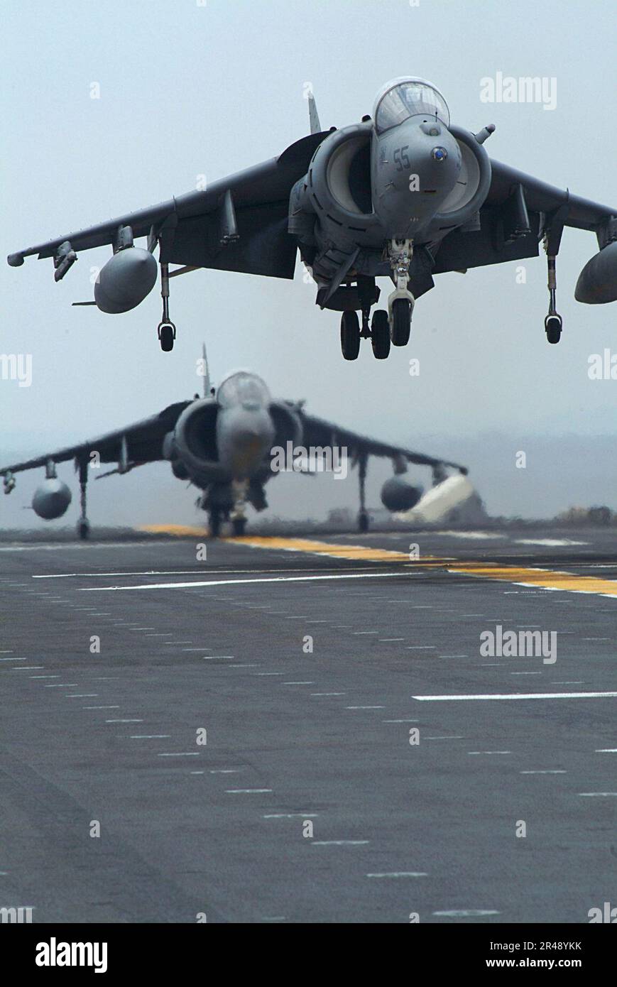 US Navy An AV-8B Harrier lands on the flight deck of USS Essex (LHD 2 ...