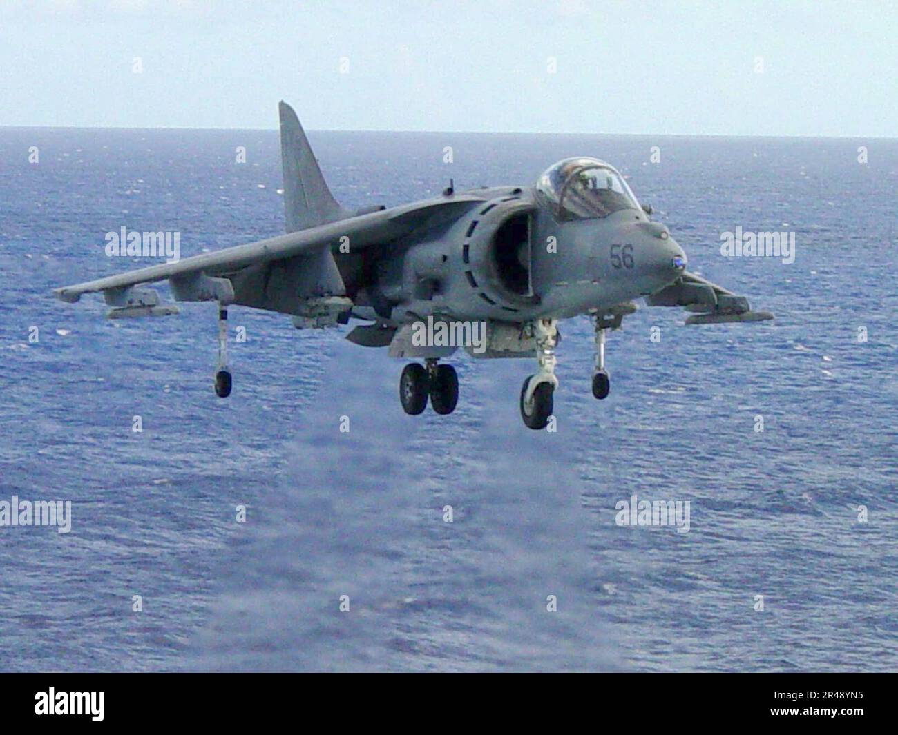US Navy An AV-8 Harrier approaches the ship's flight deck Stock Photo ...
