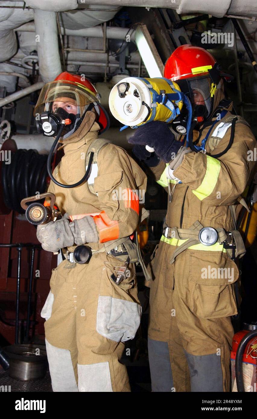 US Navy simulated checking for fire in a smoke-filled room using the ...