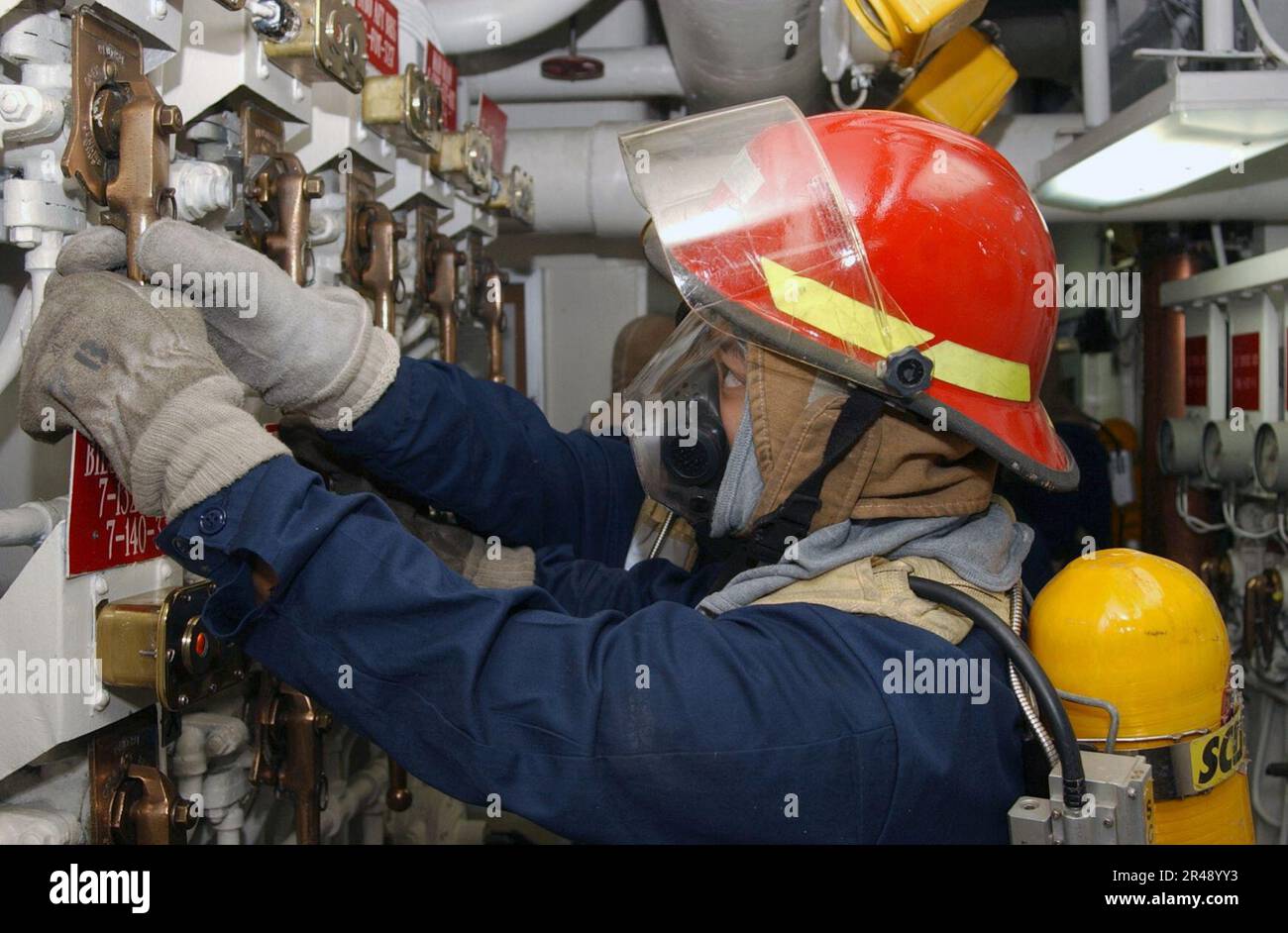 US Navy firefighter uses Stock Photo - Alamy