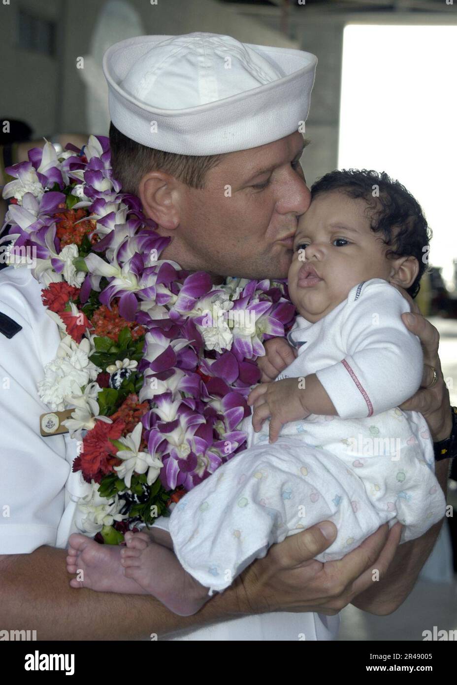 US Navy Store Keeper 1st Class meets his grandson for the first time ...