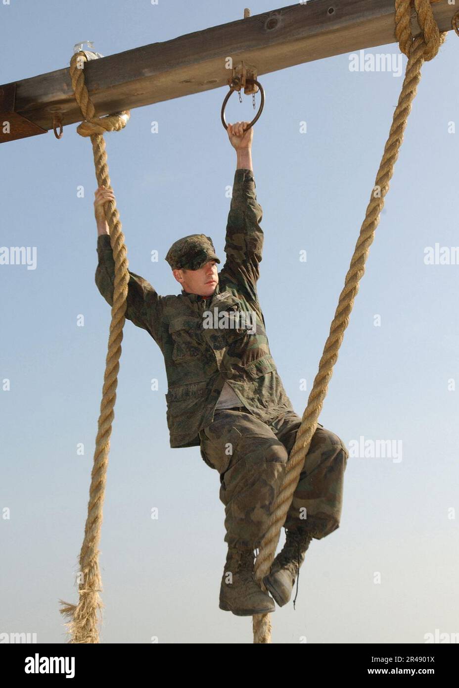 US Navy A Sailor assigned to Basic Underwater Demolition-SEAL (BUD-S ...