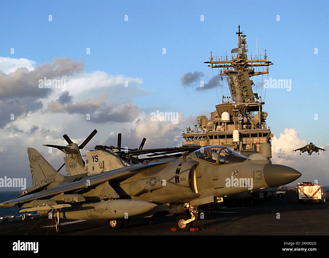 US Navy An AV-8B ''Harrier'' rests aboard Kearsarge as another (right ...