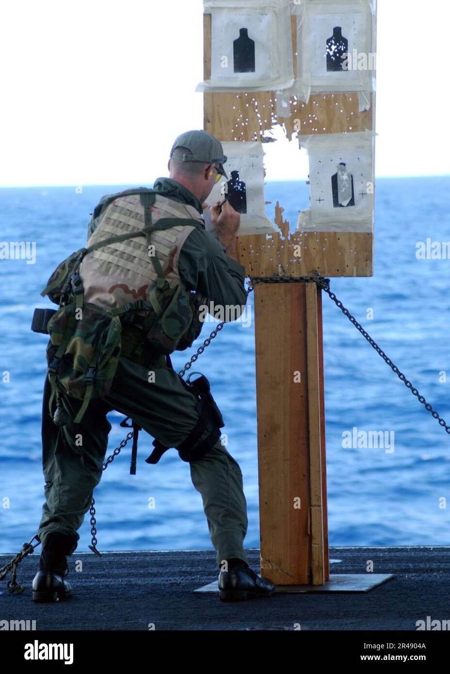 US Navy Electronics Technician 1st Class grades the target of his ...