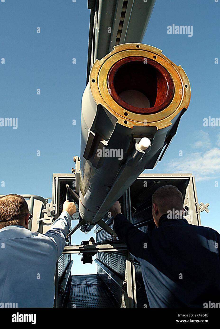 US Navy Fire Controlmen hold the wing clips closed on a NATO RIM-7 ...